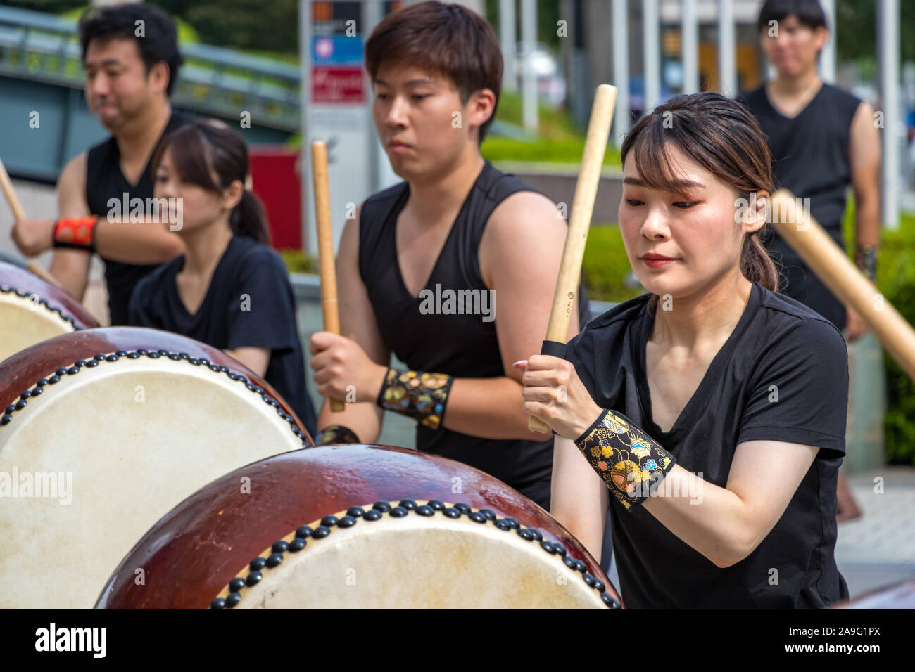 Female japanese drumer playing Taiko - Kumi-daiko performance in ...