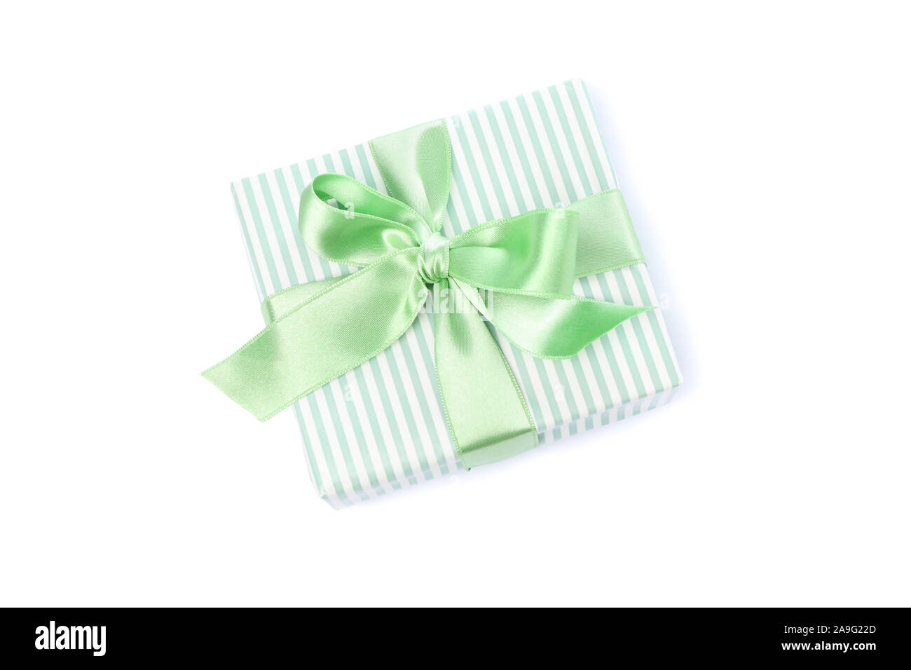 Gift box with green bow isolated on white background Stock Photo - Alamy