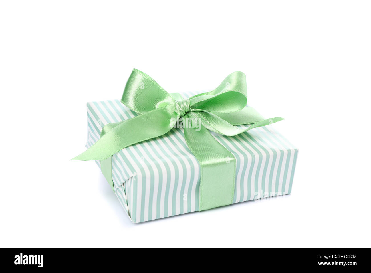 Gift box with green bow isolated on white background Stock Photo - Alamy