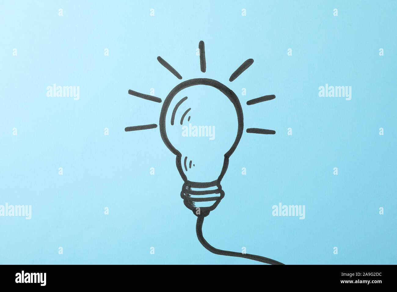 Drawn light bulb on blue background. Good idea concept Stock Photo - Alamy