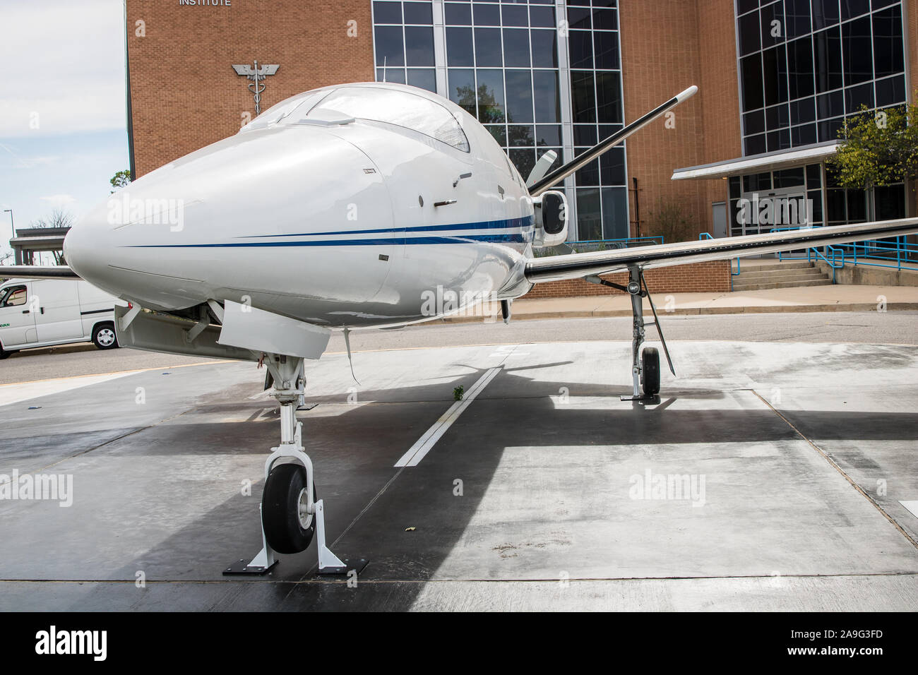 Private airplane parked outside in front of a building Stock Photo - Alamy