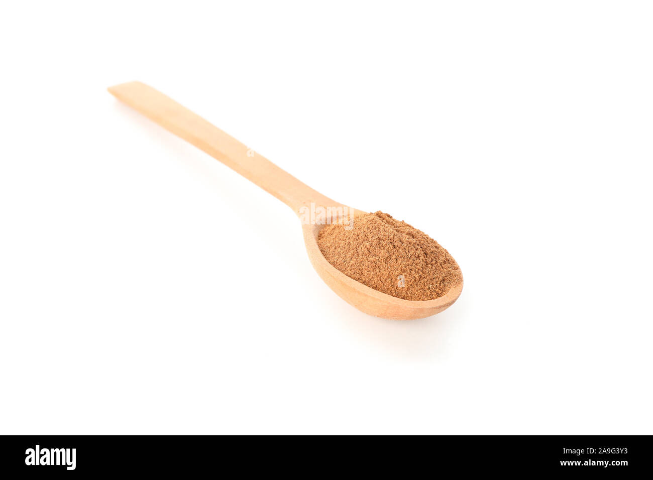 Wooden spoon with cinnamon powder isolated on white background Stock ...
