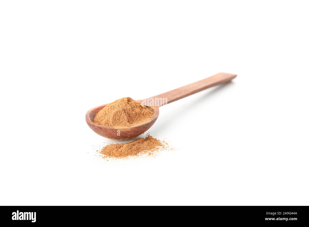 Wooden spoon with cinnamon powder isolated on white background Stock ...