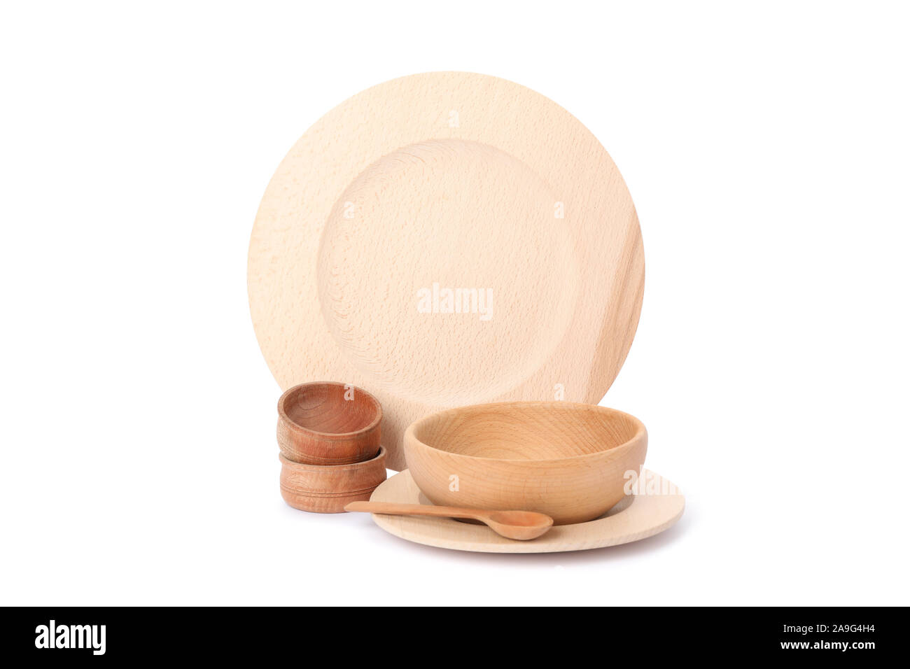 Different wooden tableware isolated on white background Stock Photo - Alamy