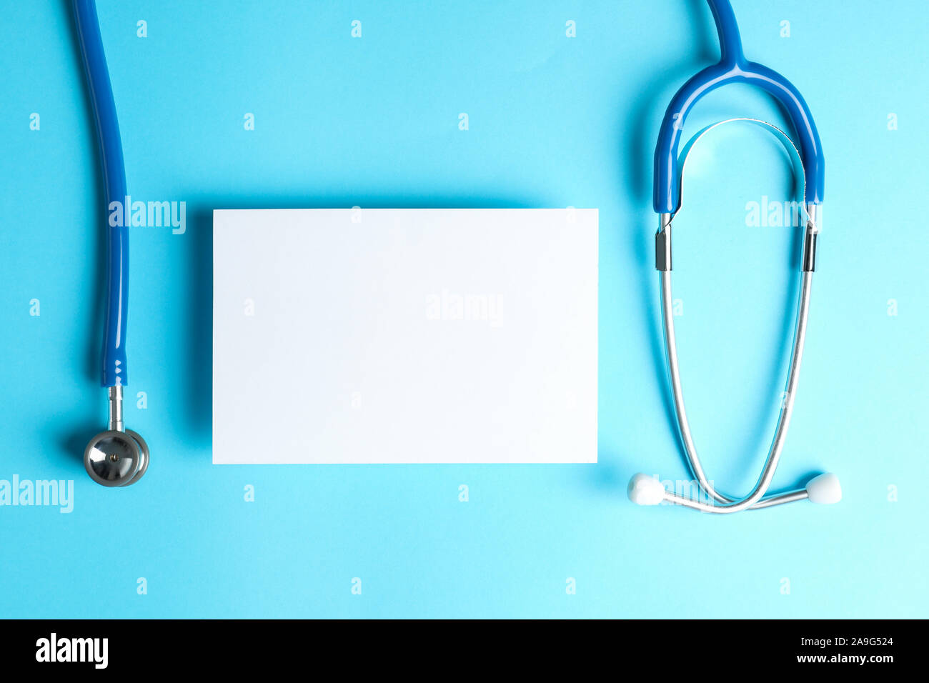 Stethoscope and notepad on a blue background, space for text Stock ...