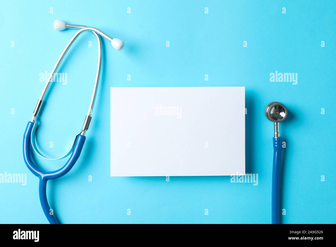 Stethoscope and notepad on a blue background, space for text Stock ...