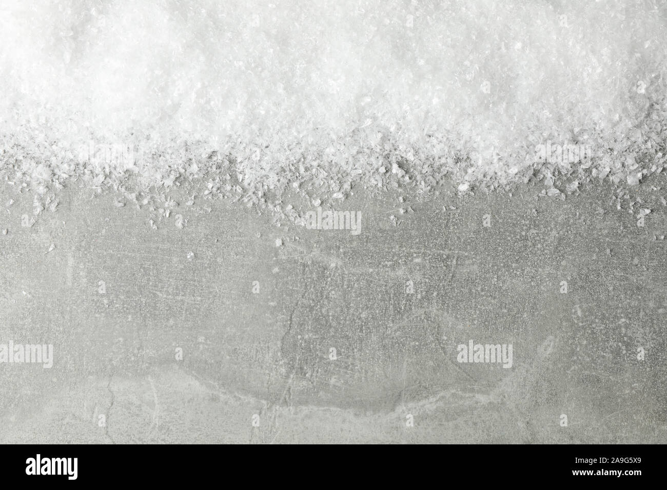 Decorative snow on grey background, space for text Stock Photo - Alamy