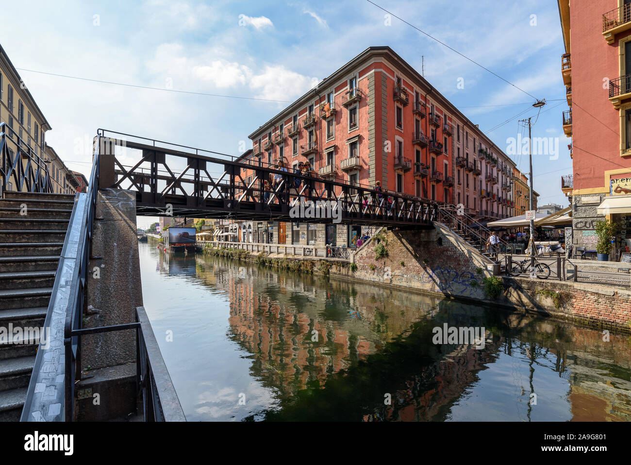 MILAN, ITALY - SEPTEMBER 10, 2018: tourists crossing an iron bridge ...