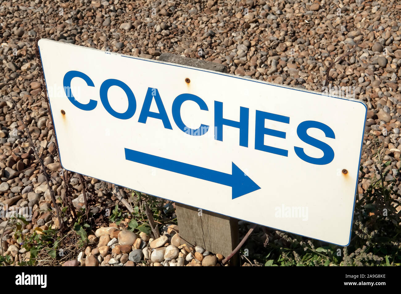 A sign instructing coaches which way to go Stock Photo - Alamy