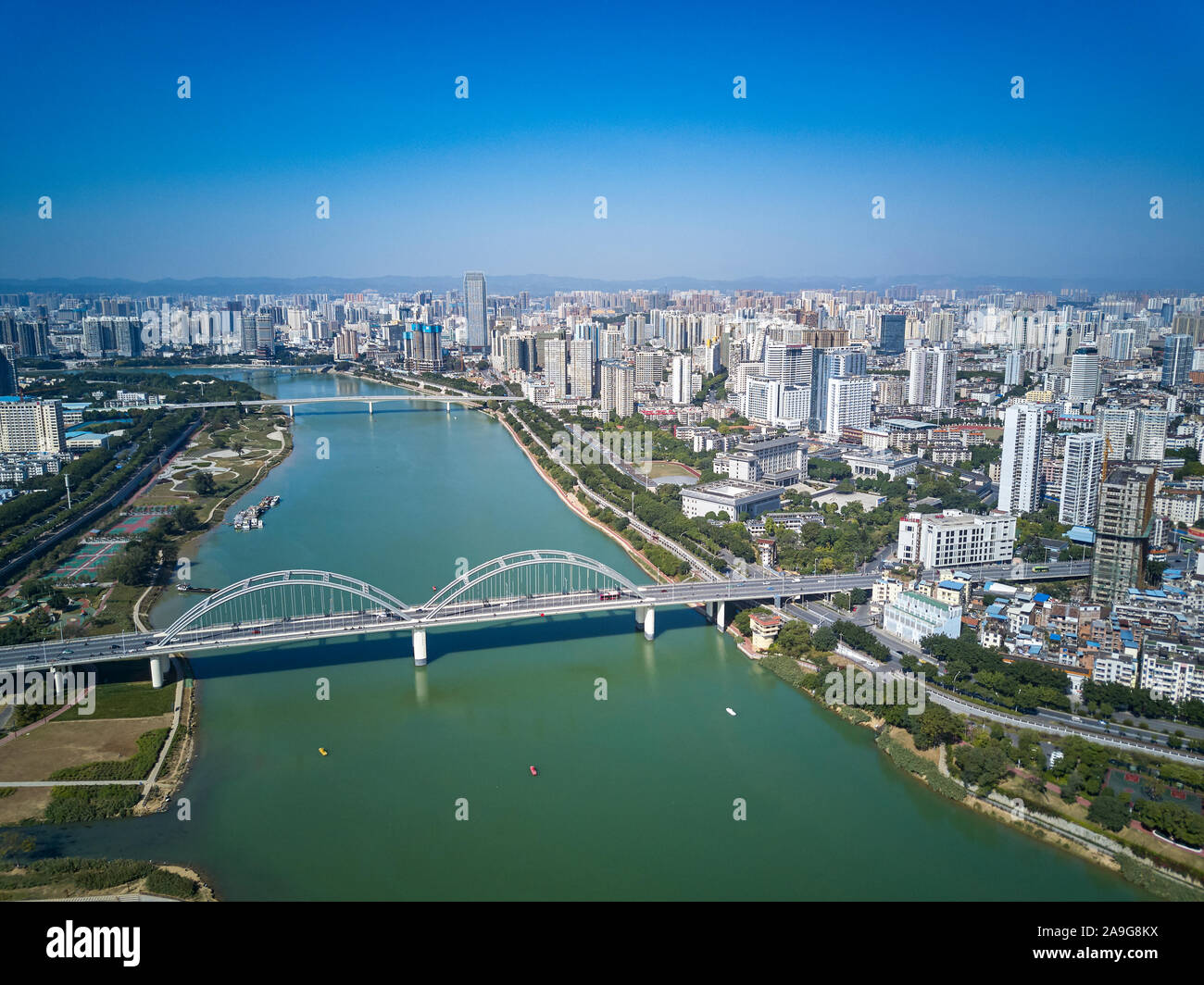 Aerial photos of high-rise residential area along the river and bridge ...