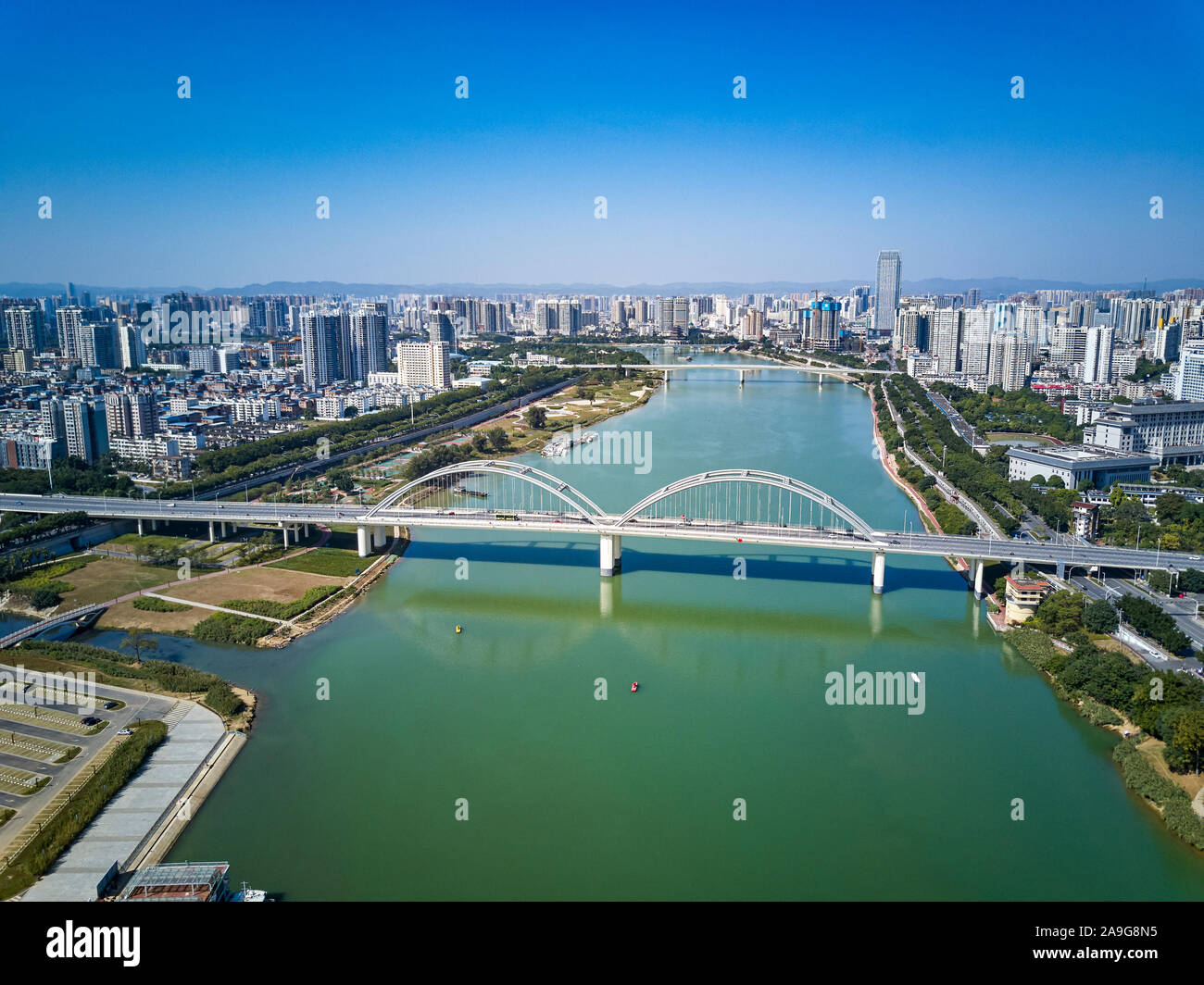 Aerial photos of high-rise residential area along the river and bridge ...