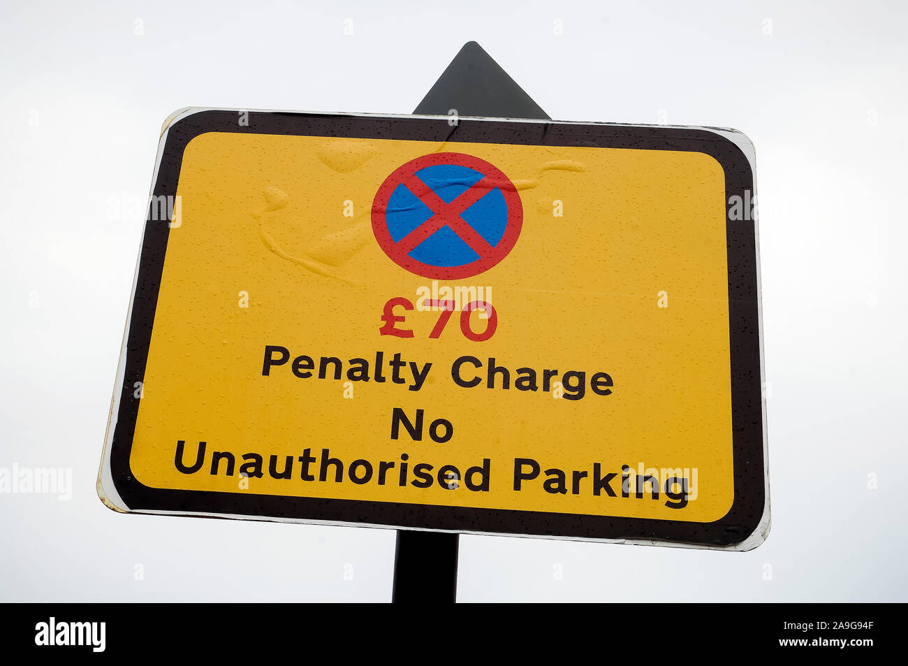 A sign telling drivers that the area has no unauthorised parking and ...