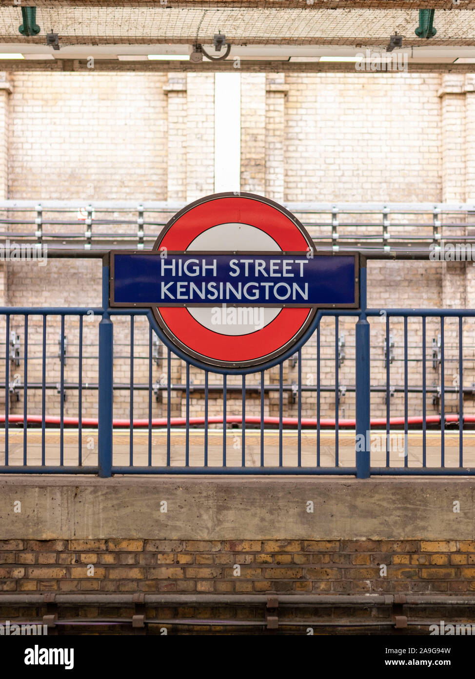 Tube station sign at High Street Kensington in London Uk Stock Photo ...