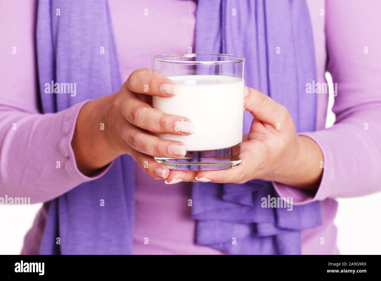 Female Hands Holding A Glass Of Milk Stock Photo - Alamy