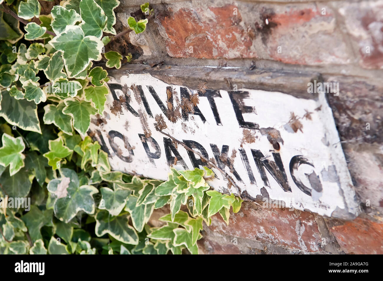 An old wooden sign saying 'Private No Parking' Stock Photo - Alamy
