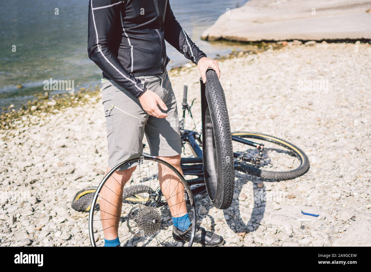 Bike Repair. Man Repairing Mountain Bike. Cyclist man in trouble rear ...