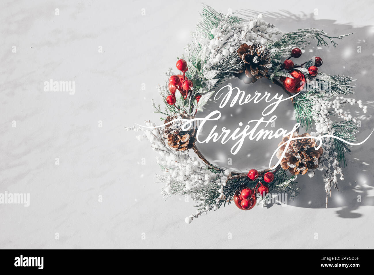 Beautiful christmas wreath frame on fresh white snow Winter vacation ...