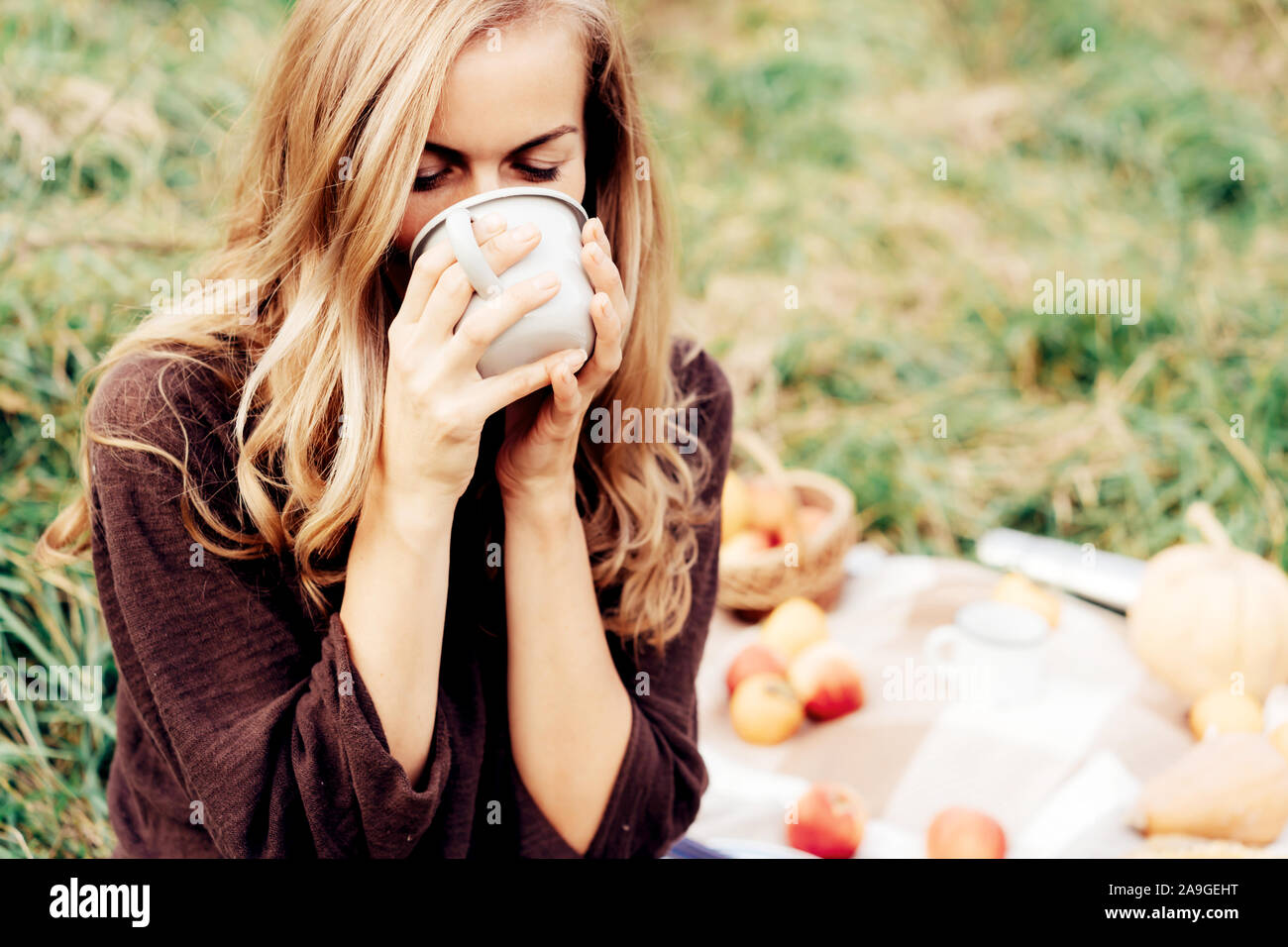 Girl enjoying drinking tea hi-res stock photography and images - Alamy