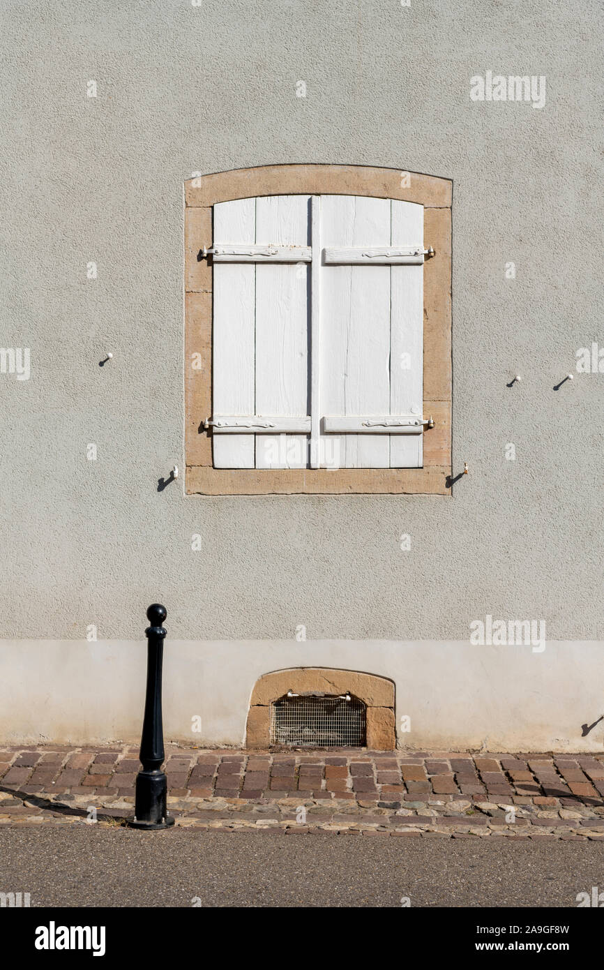 Old shuttered windows on old buildings in Eguisheim Alsace France ...