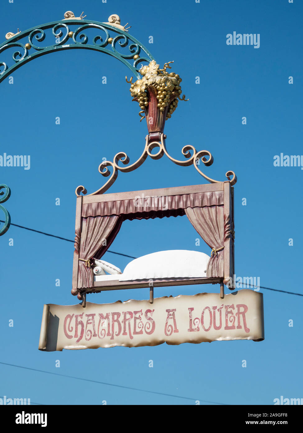 A traditional wrought iron sign for a hotel or rooms to rent, chambres ...