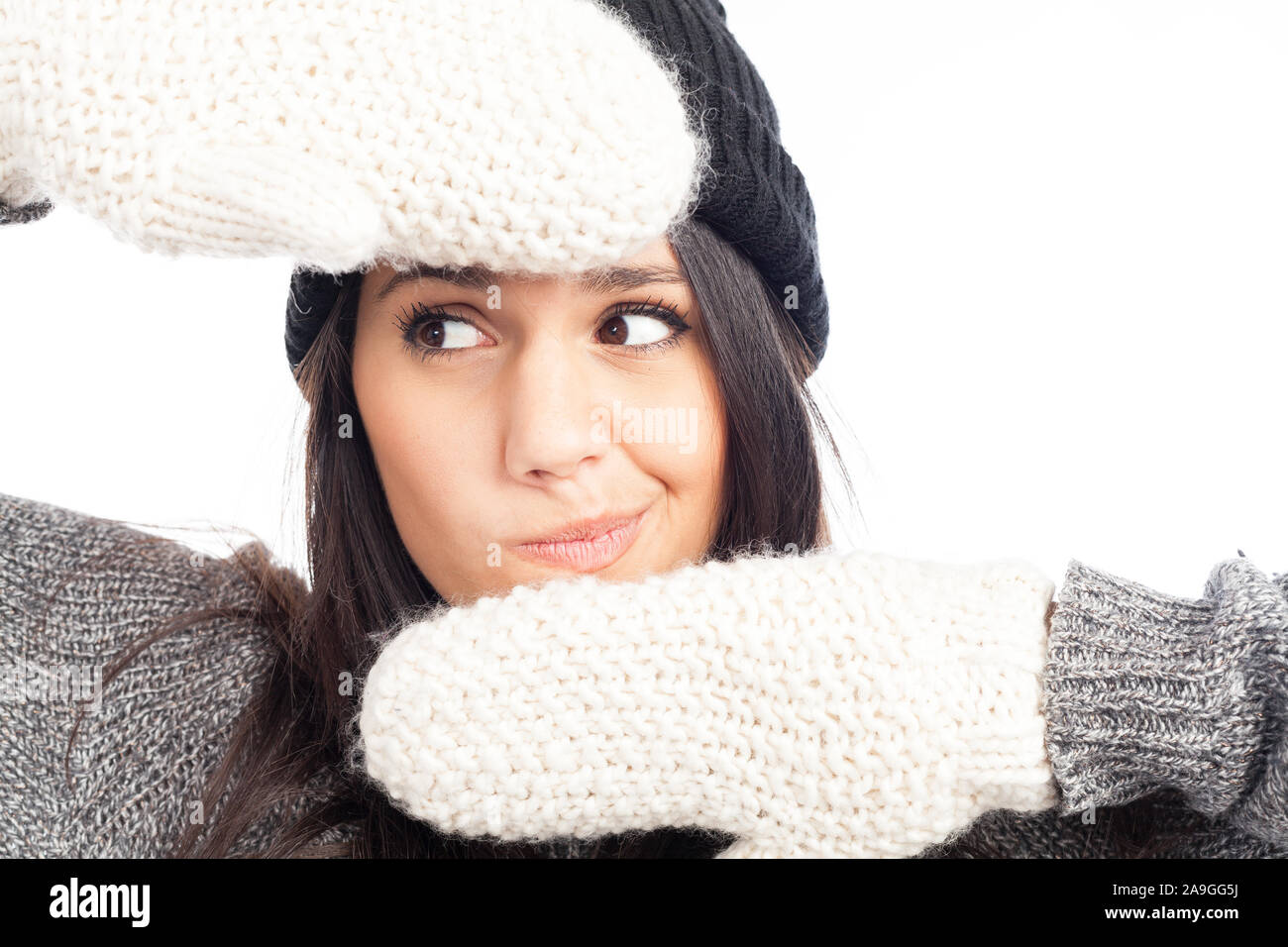 Pretty Brunette Woman With A Woolen Hat A Sweater And Gloves Smiling