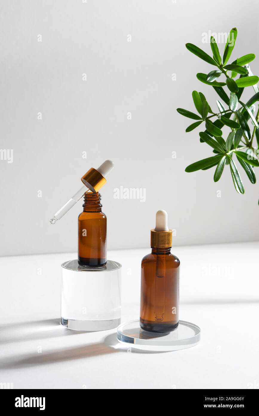 natural cosmetic skincare or essential oil bottles container and green ...