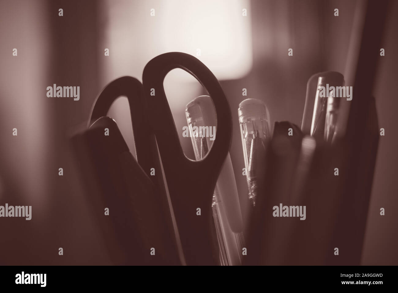 stationery set of pencils and scissors in a stand, sepia photo Stock ...