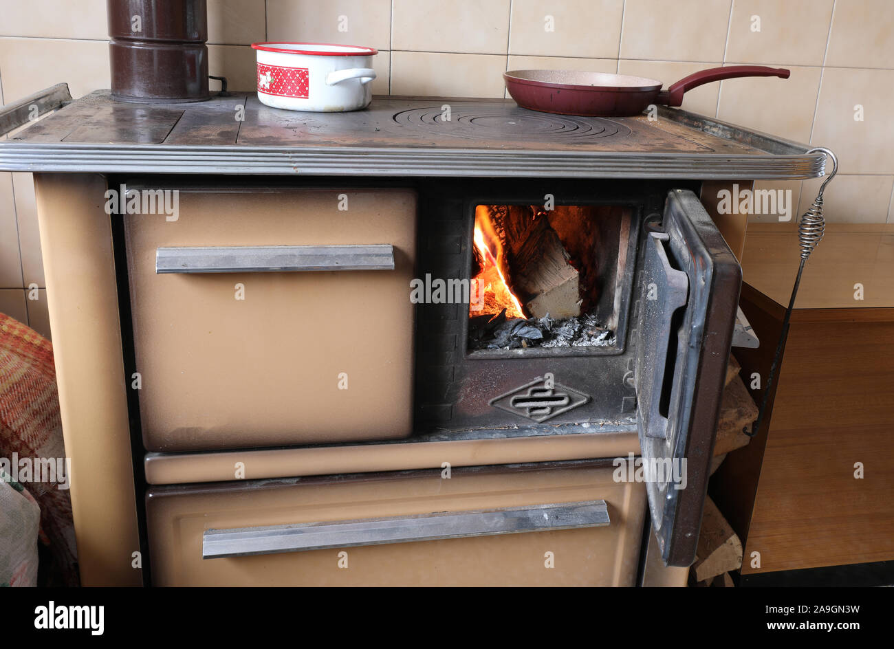 pot over the fire of a stove in a mountain hut Stock Photo - Alamy