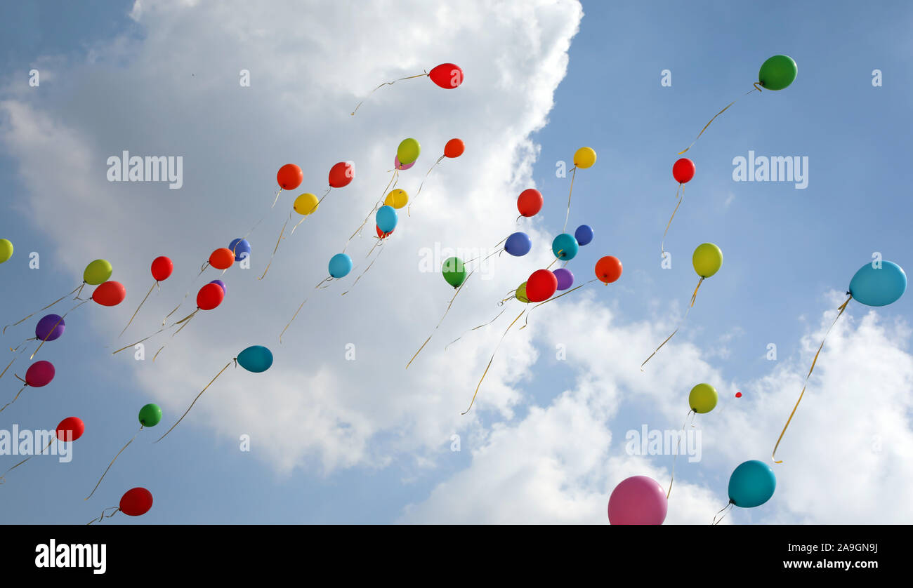 many colored balloons fly in the sky Stock Photo - Alamy