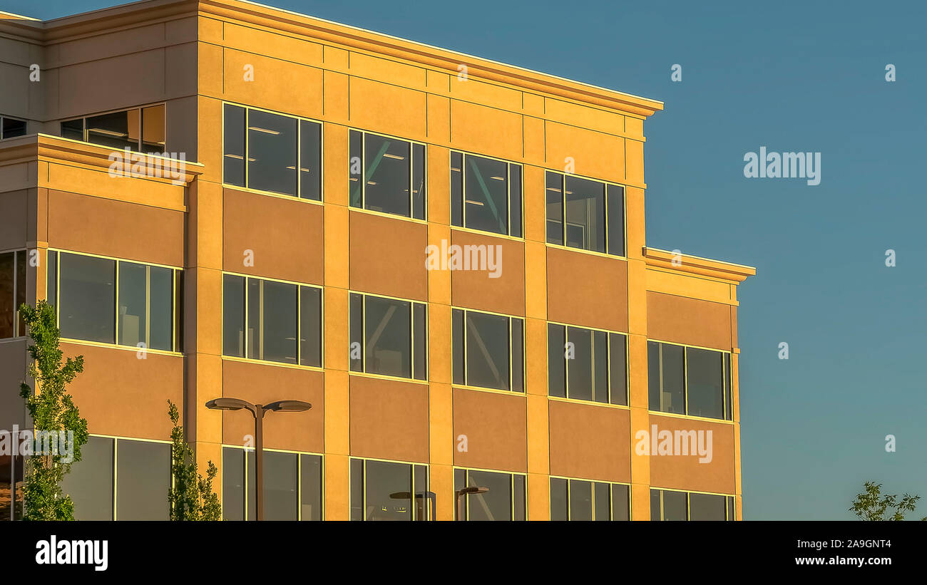 Panorama Commercial building exterior with mountain and sky background ...