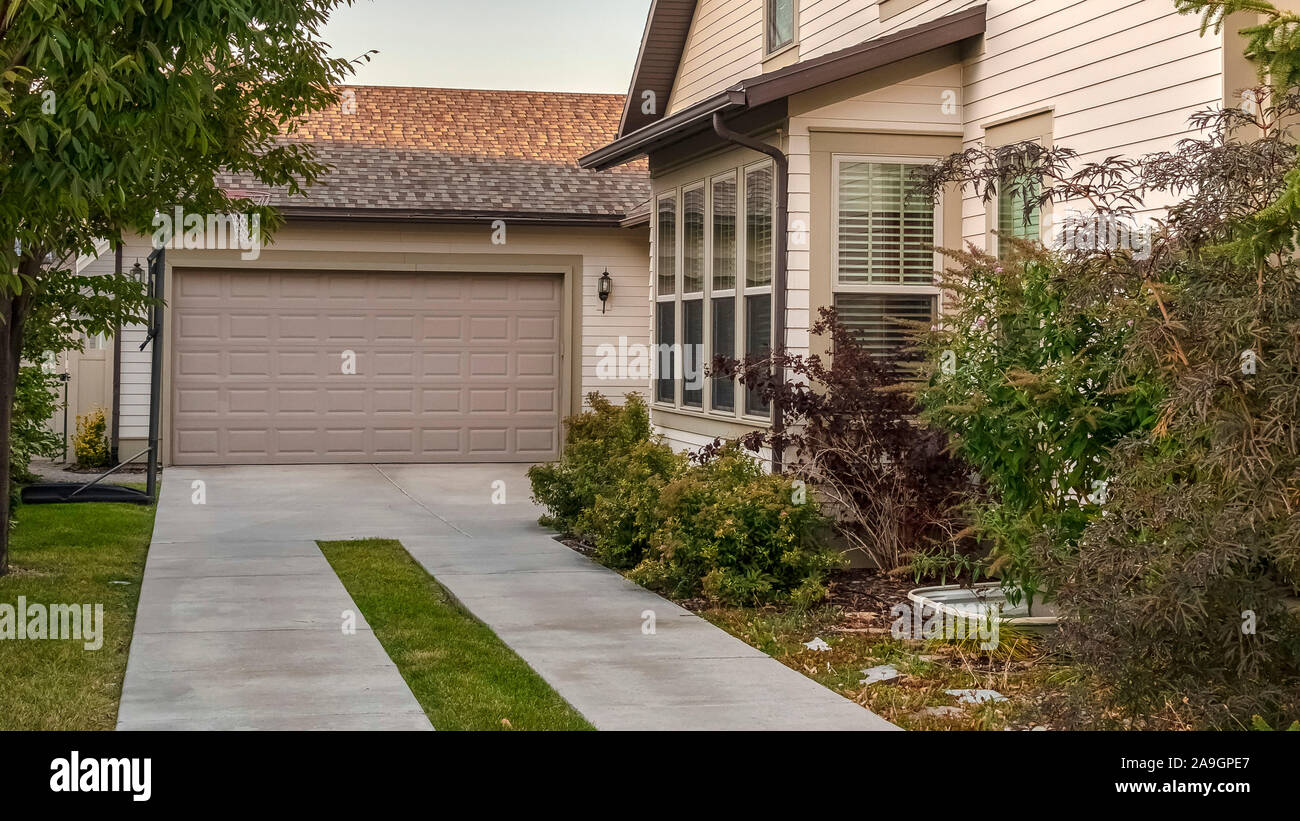 Panorama frame Concrete driveway leading to a double garage Stock Photo ...