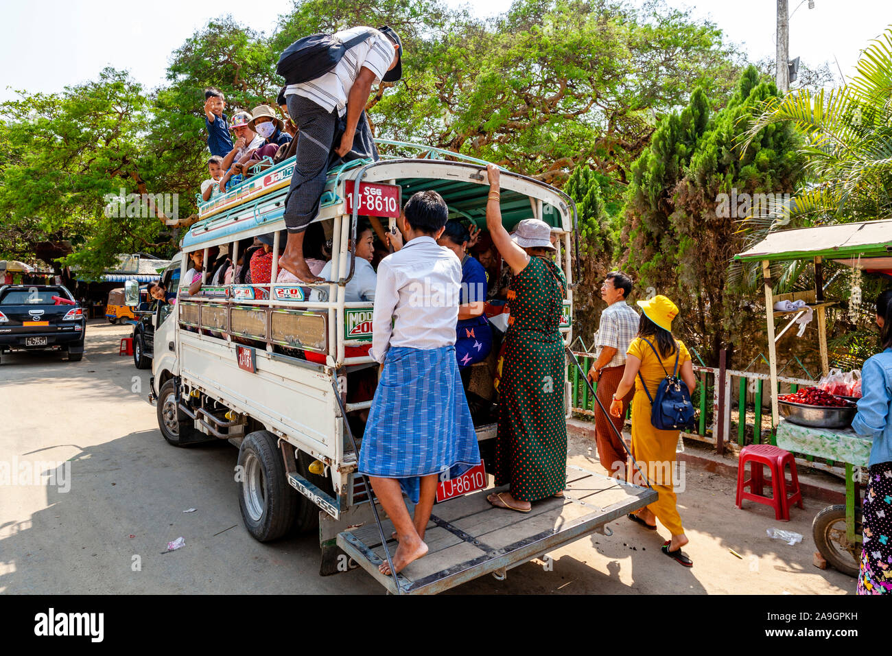 Burmese People Climb Aboard A Pick Up Truck, Mandalay, Myanmar Stock ...