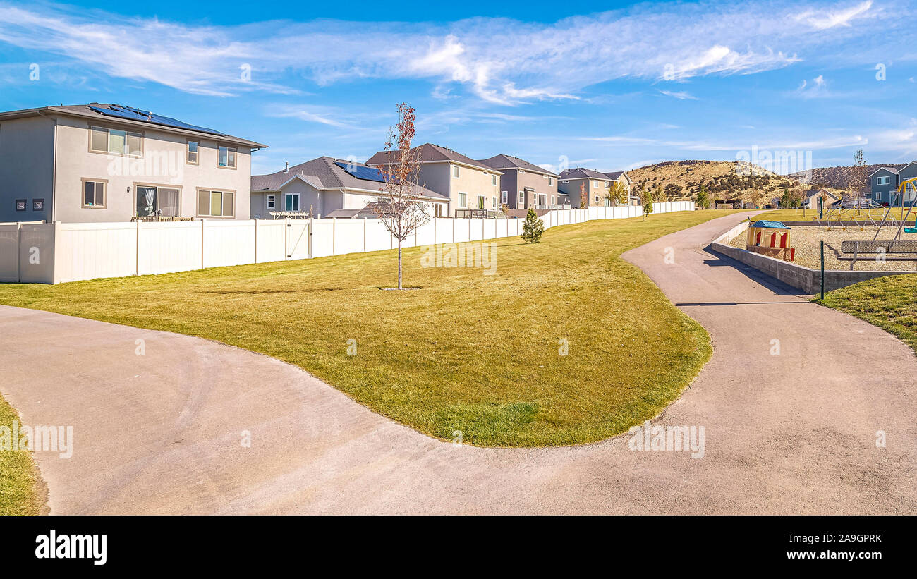 Panorama frame Forked paved pedestrian walkway in a park Stock Photo ...