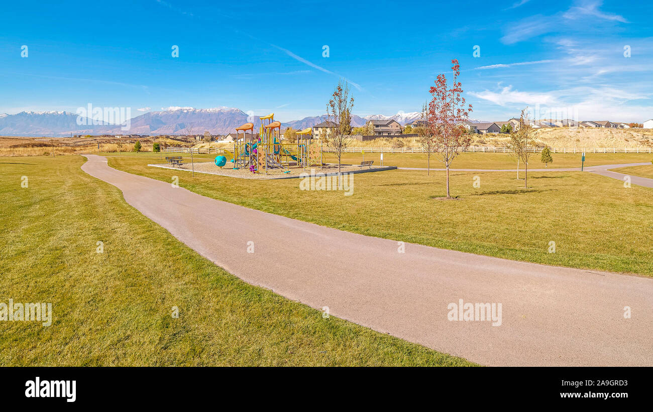 Panorama frame Kids playground in a neatly landscaped park Stock Photo ...