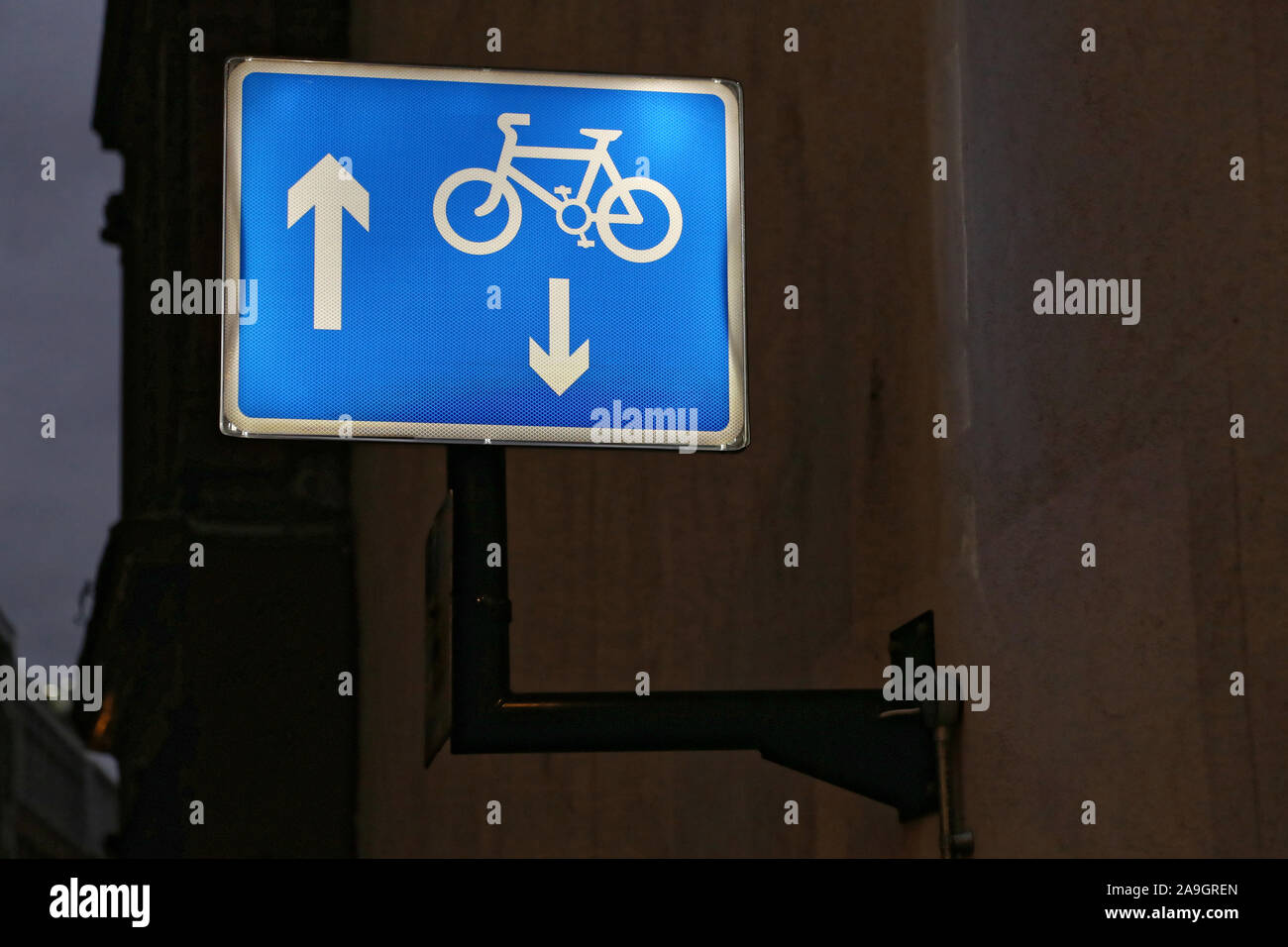 Illuminated Blue Sign for Bike Lane Traffic Stock Photo - Alamy