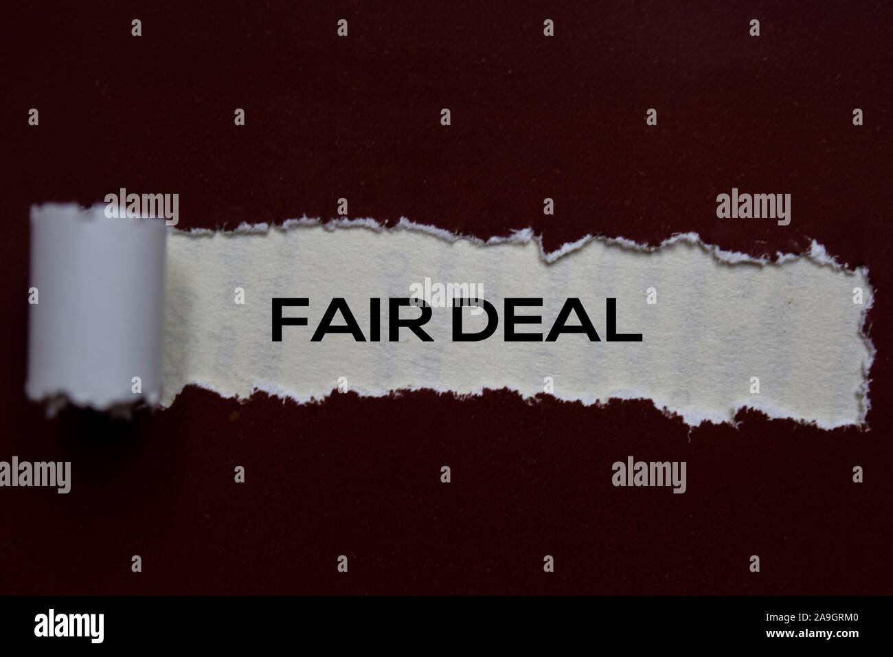 Fair Deal Text written in torn paper Stock Photo - Alamy