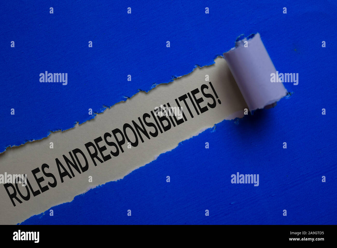 Roles And Responsibilities! Text written in torn paper Stock Photo - Alamy