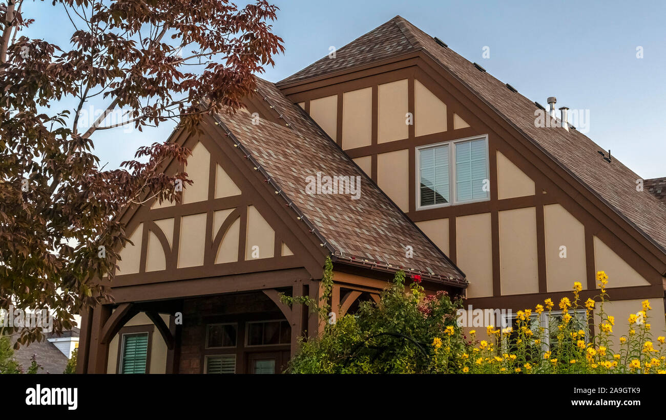 Panorama frame Unusual timber frame house with double apex roof Stock ...