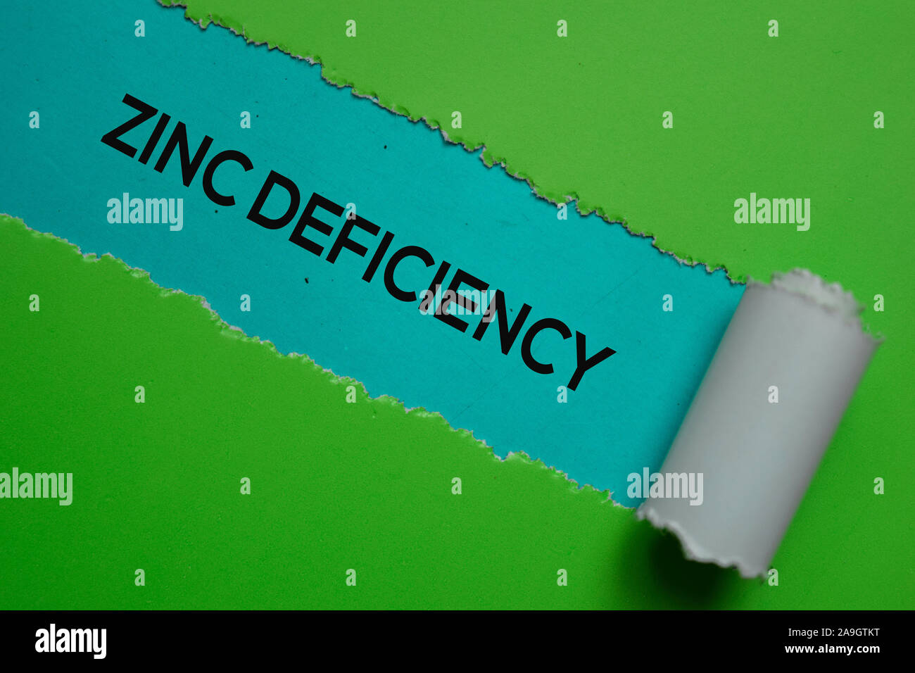 Zinc Deficiency Text written in torn paper. Medical concept Stock Photo ...