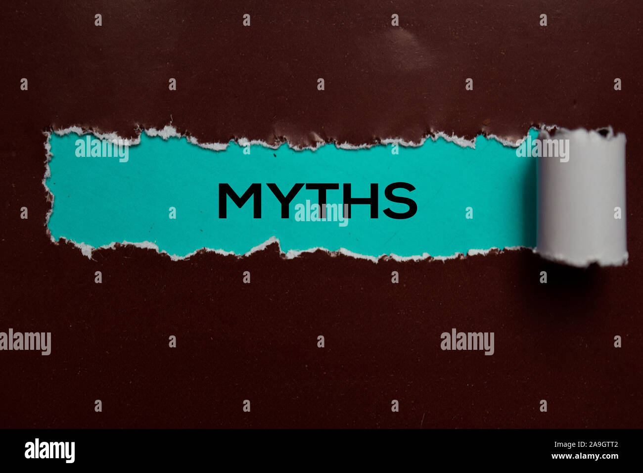 Myths Text written in torn paper Stock Photo - Alamy