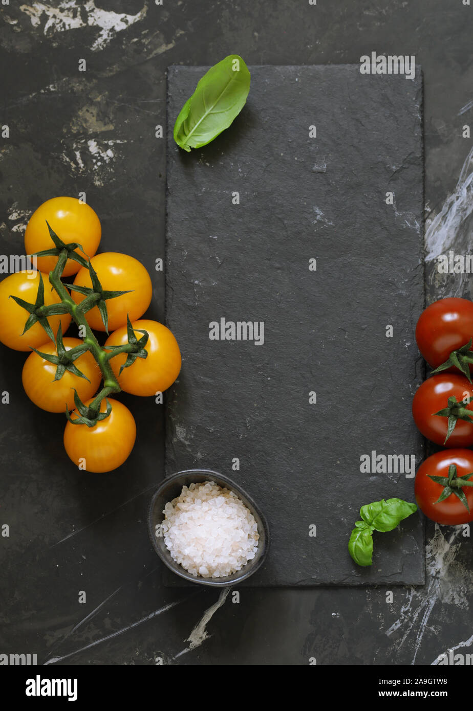 background for food menu, black graphite and tomatoes Stock Photo - Alamy