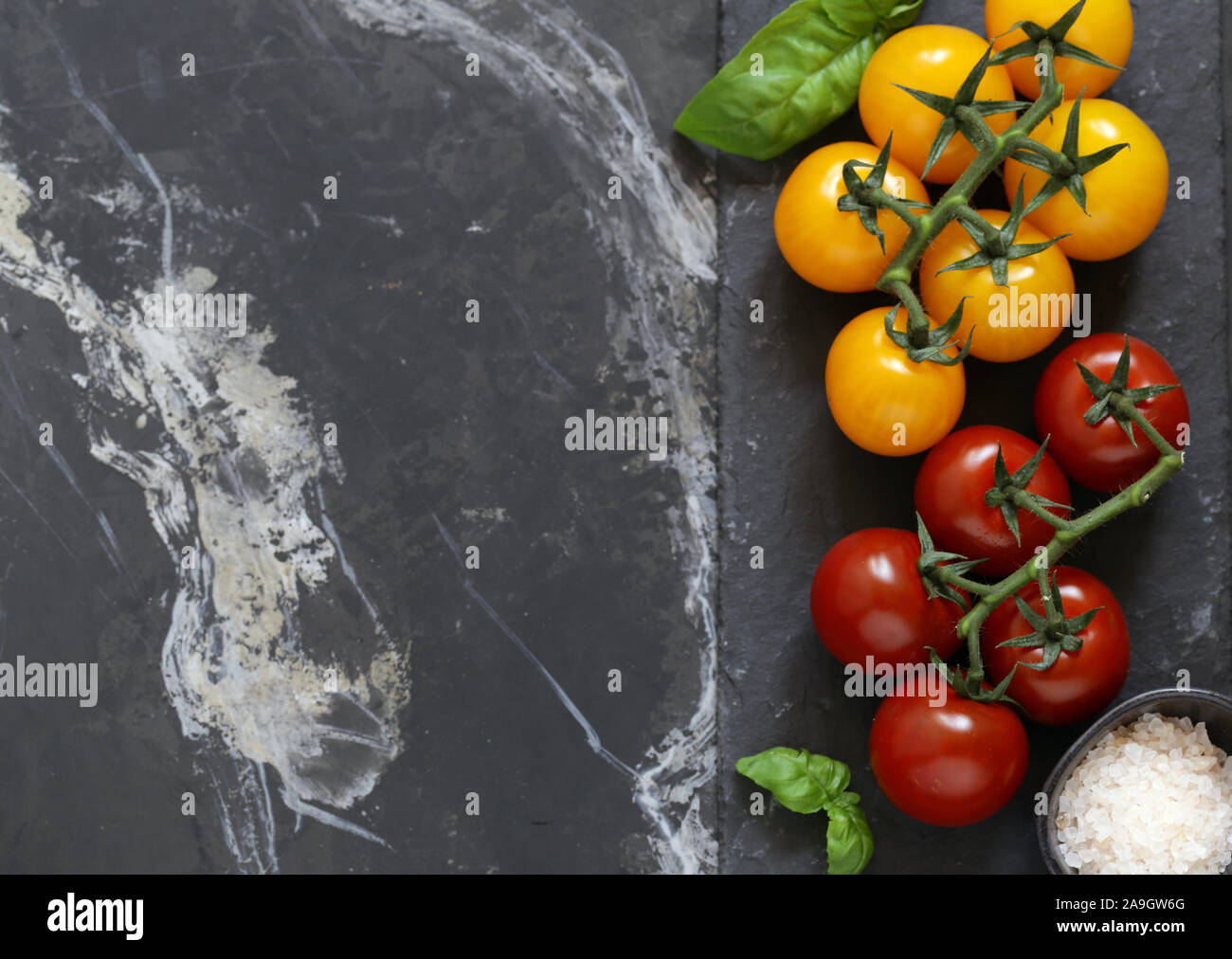 background for food menu, black graphite and tomatoes Stock Photo - Alamy