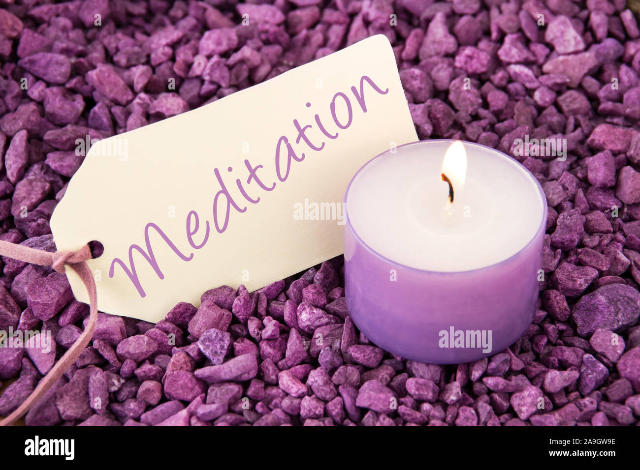 Meditation label and candle Stock Photo - Alamy