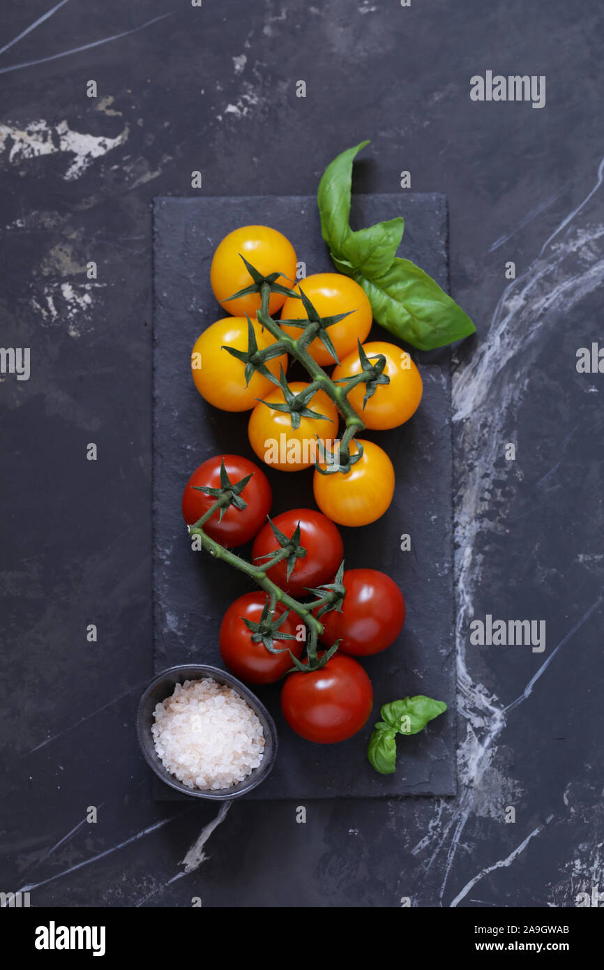background for food menu, black graphite and tomatoes Stock Photo - Alamy