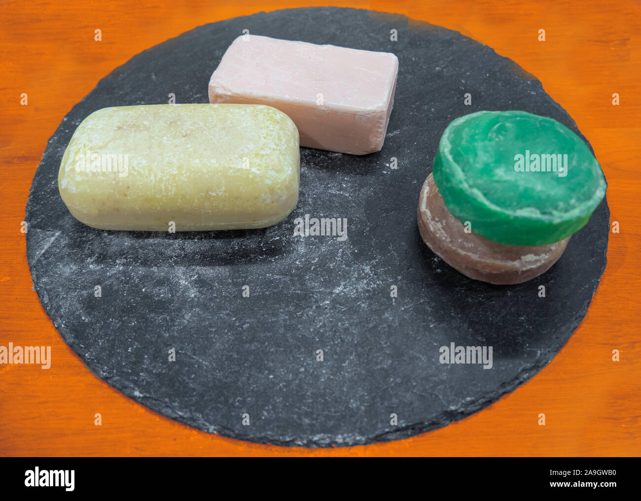 handmade soaps with different aromas and bright colors, displayed on a ...