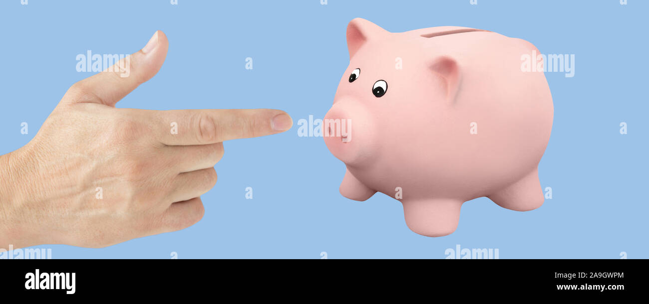 Male hand and piggy bank Stock Photo - Alamy