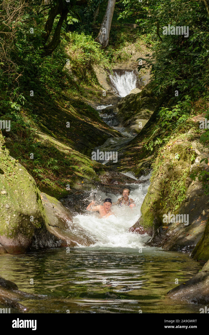 Taveuni Island, Fiji - 06/27/2014: Tourists sliding down the Waitavala ...