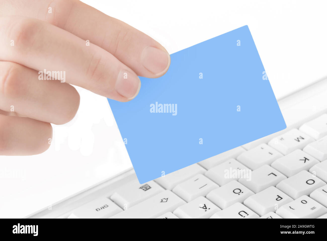 Male hand and blue label Stock Photo - Alamy