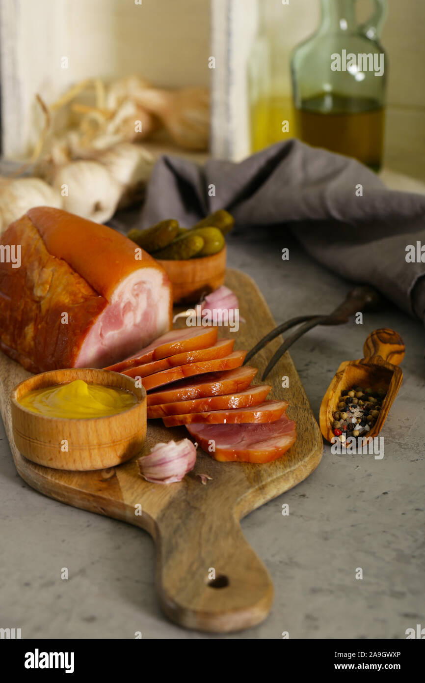 smoked pork knuckle meat with mustard and pickles Stock Photo - Alamy
