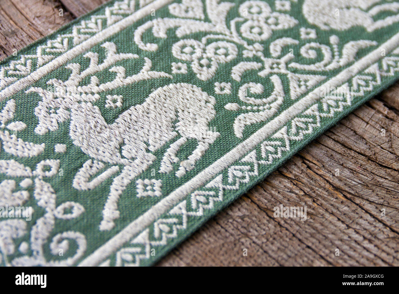 Handcraft stitching and wooden background Stock Photo - Alamy